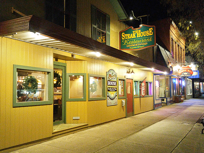 By night, this unassuming steakhouse glows with promise – like finding a treasure chest at the end of a delicious quest.
