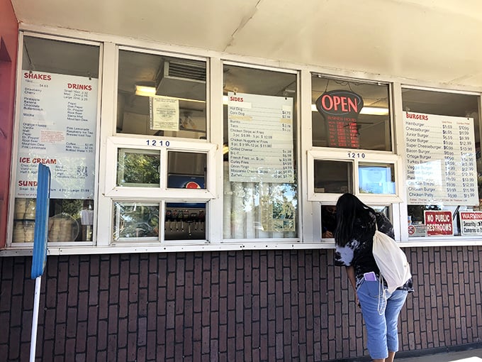Old-school ordering windows where food dreams come true. No apps, no delivery drivers—just you, your hunger, and imminent satisfaction. 