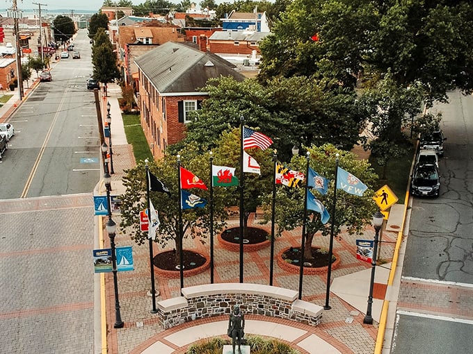 A colorful array of international flags stands sentinel in this waterfront plaza, proving small towns can think globally while celebrating locally.