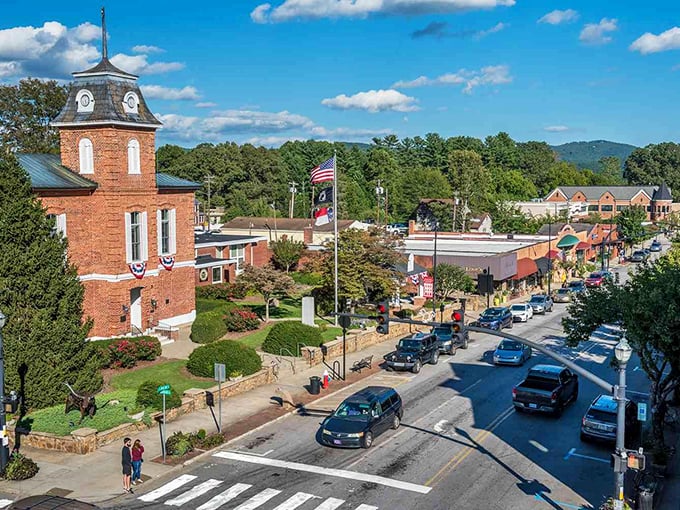 The historic courthouse stands sentinel over downtown, its red brick tower a reminder that some things—like community and charm—never go out of style.