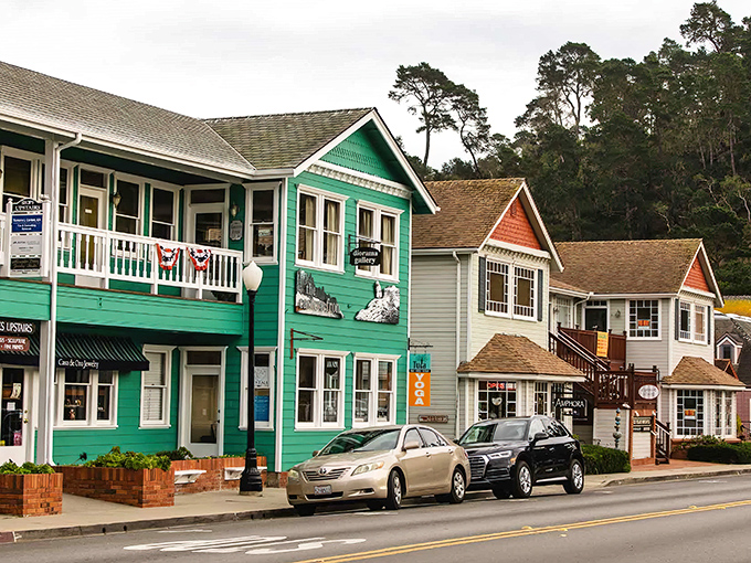 Downtown Cambria's colorful buildings stand like a box of crayons someone arranged perfectly, inviting you to explore each vibrant storefront.