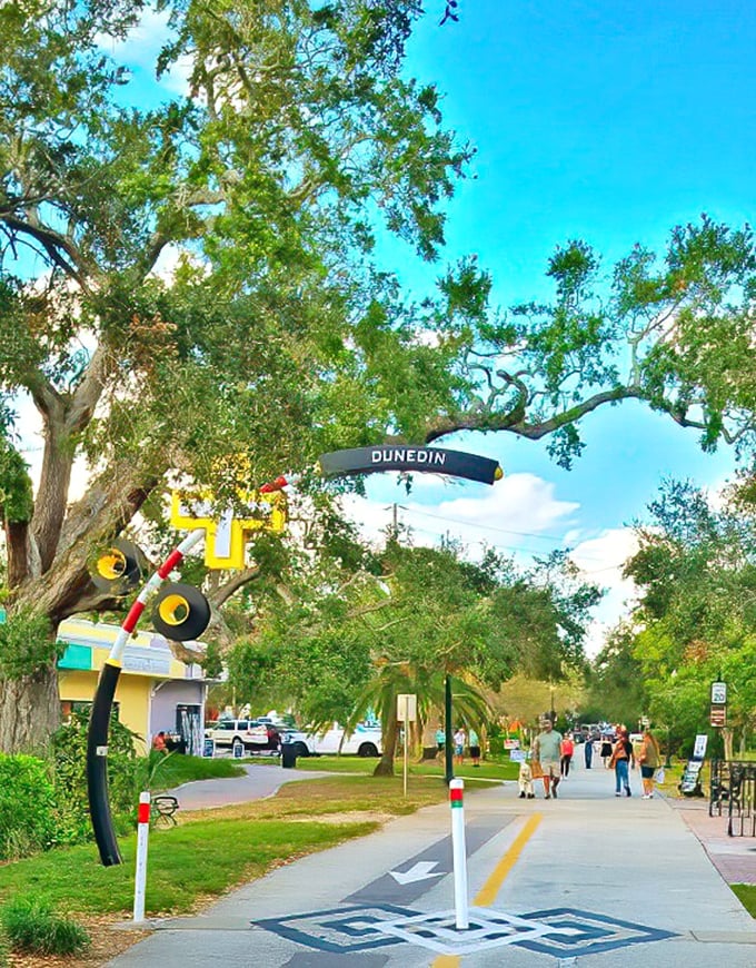 The Pinellas Trail welcomes visitors with whimsical art and that signature Dunedin arch—like a portal to a more relaxed way of life