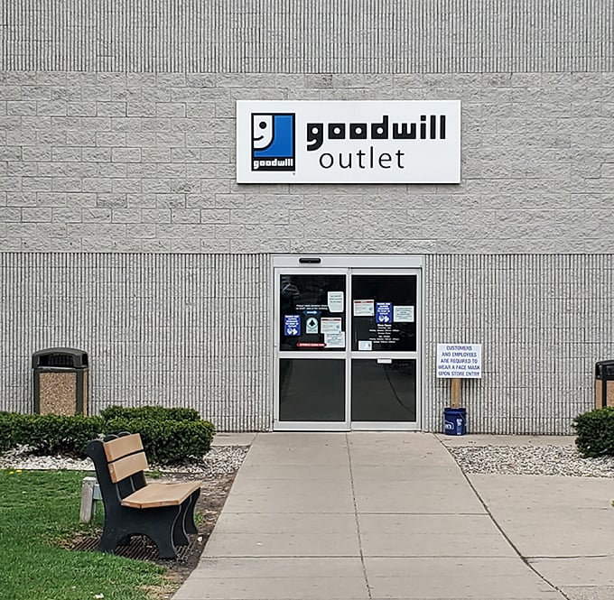 The unassuming entrance belies what lies beyond—a no-frills gateway to thrifting nirvana where savvy shoppers transform modest budgets into impressive hauls.