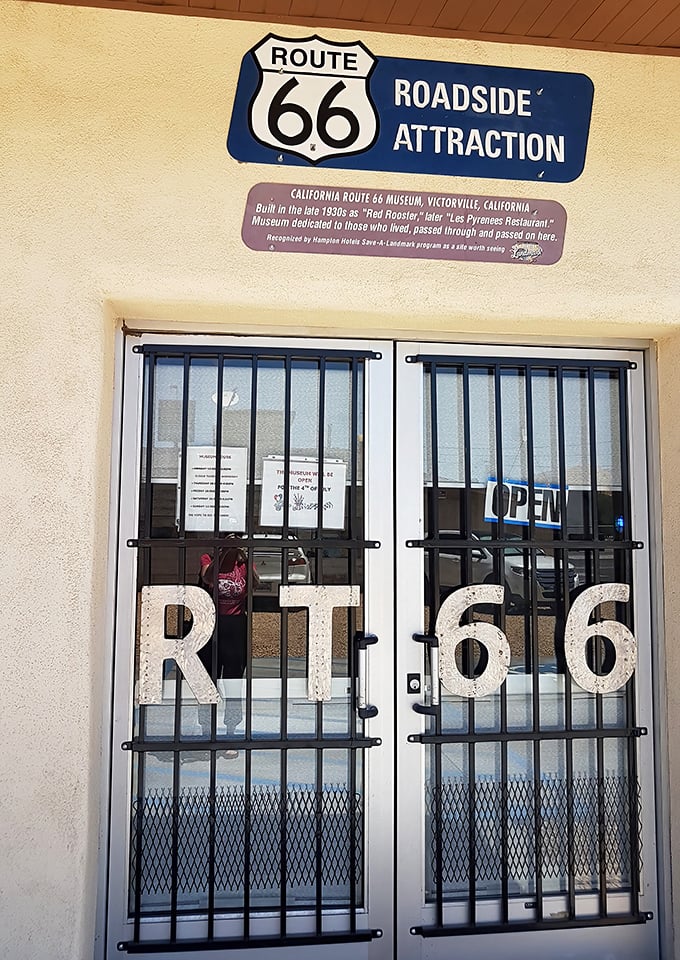 "RT 66" emblazoned on security doors—the perfect roadside attraction entrance. Like finding the secret password to America's highway history club.