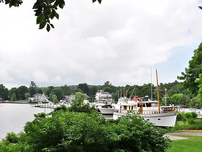 Classic wooden boats bob gently against the backdrop of white clapboard homes – it's like someone bottled the essence of coastal New England.