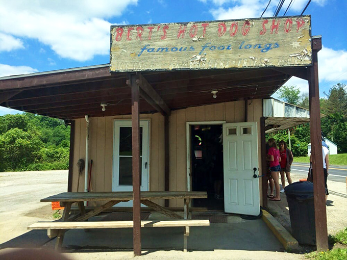 Weathered wood, faded paint, and a promise of "famous foot longs" – this humble façade conceals Pennsylvania's worst-kept culinary secret.