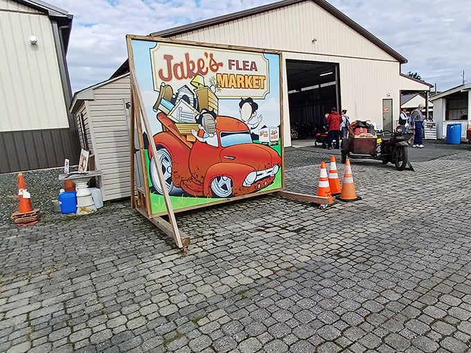 This whimsical sign perfectly captures the spirit of Jake's – a cartoon character zooming off with more treasures than his vintage convertible can reasonably hold.