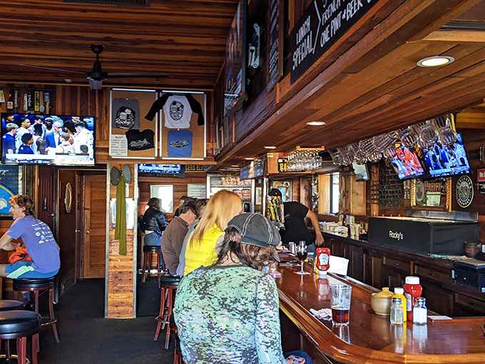Inside Rocky's, warm wood paneling and a well-worn bar create the perfect backdrop for burger bliss. No pretension here—just good vibes and better food.