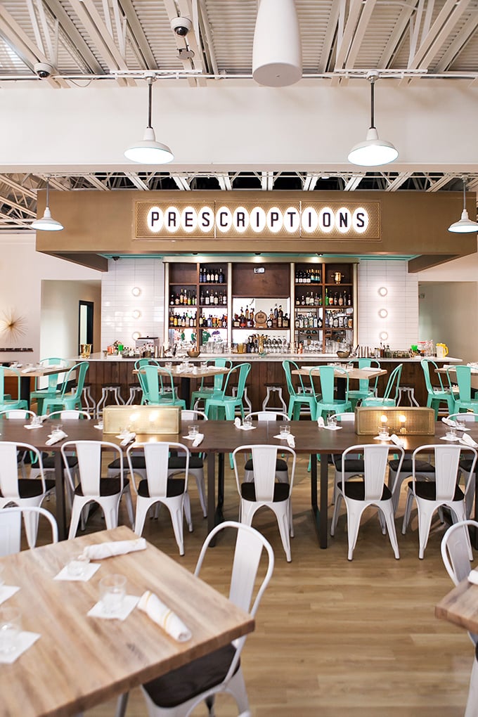 The "PRESCRIPTIONS" sign above the bar isn't false advertising—these cocktails and comfort foods might be the cure for whatever ails you.