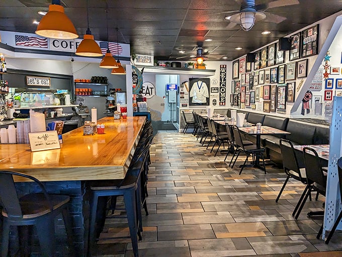 Where nostalgia meets appetite. The walls tell stories while the counter invites you to pull up a seat and stay awhile. Orange pendant lights cast a warm glow that says "home."