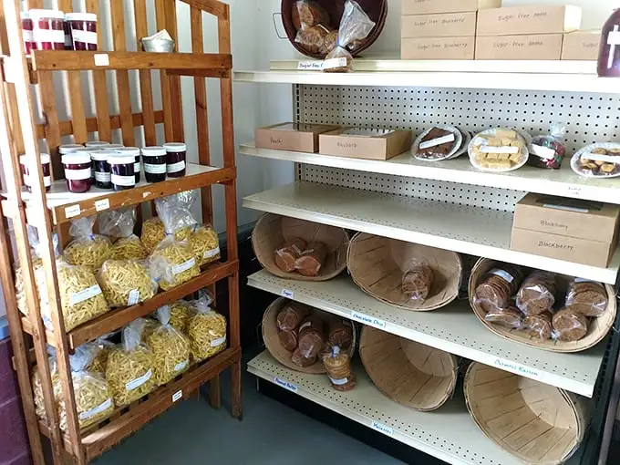 Simple wooden shelves lined with homemade treasures—proof that the best inventory systems have nothing to do with computers and everything to do with caring.