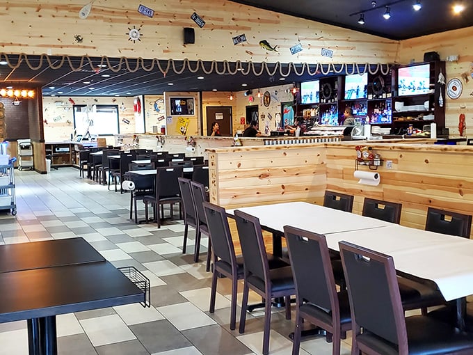 Warm wooden paneling and nautical touches create a cozy cabin vibe—if cabins specialized in crab legs and seafood feasts.