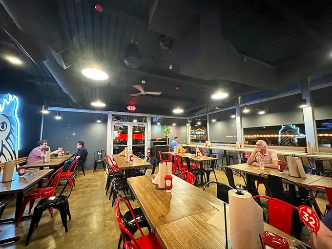 Industrial-chic meets Southern hospitality in this no-nonsense dining room. Red metal chairs stand ready for the brave souls about to test their heat tolerance.