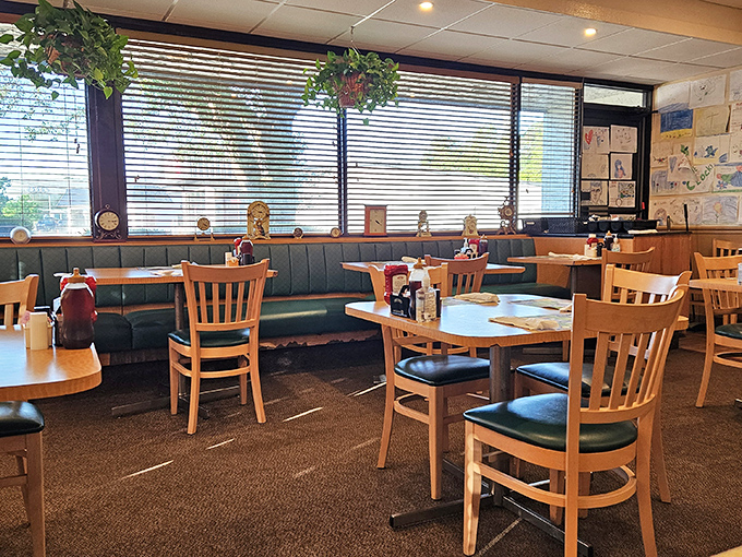 Classic diner comfort with teal vinyl booths and wooden chairs – where conversations flow as freely as the coffee. Children's artwork on the walls tells you families have been coming here for generations.