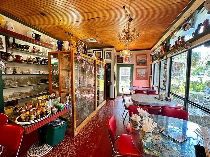 Step inside and time slows down. The honey-colored wooden ceiling, vintage display cases, and that unexpected chandelier create a delightful time capsule effect.