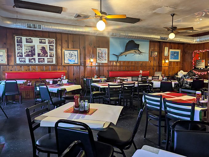 Wood paneling, mounted fish, and nautical decor create that classic Maryland crab house vibe—like stepping into your seafood-obsessed uncle's den.