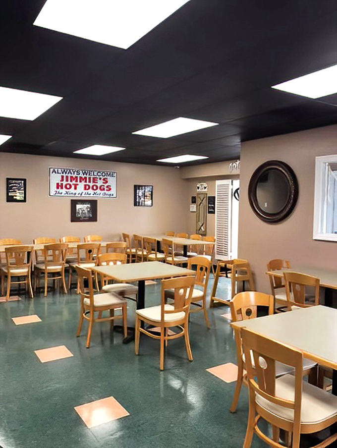 Simple wooden chairs, clean tables, and that distinctive green-flecked floor—Jimmie's dining room is a masterclass in unpretentious American eatery design.