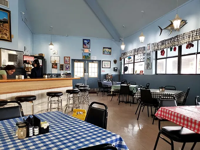 Blue walls, checkered tablecloths, and fishing memorabilia create the perfect backdrop for morning conversations and coffee refills.