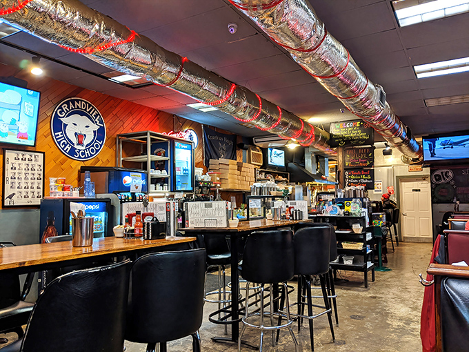 Exposed ductwork wrapped in festive decorations and local memorabilia create that perfect "come as you are" vibe. Comfort food deserves a comfortable setting.