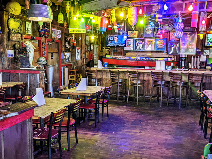 Step inside and you're greeted by a kaleidoscope of colorful string lights, weathered wood, and nautical treasures—like a pirate's hideout that serves hushpuppies.