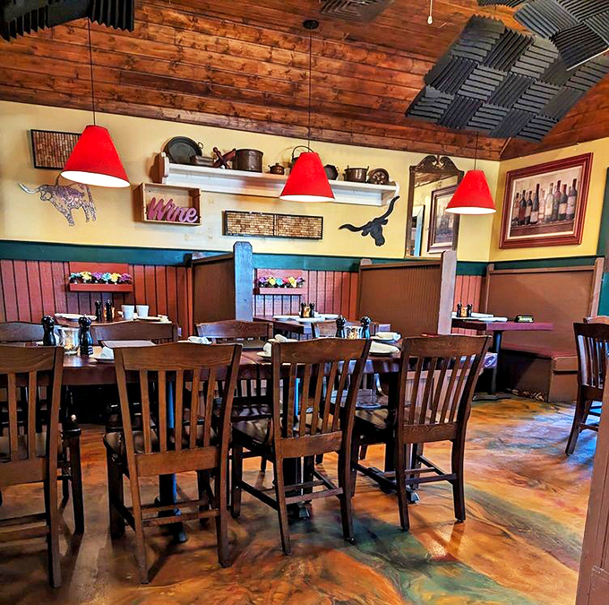 Wooden beams, red pendant lights, and that rustic ceiling create the perfect atmosphere for serious eating—comfort doesn't always need to whisper.