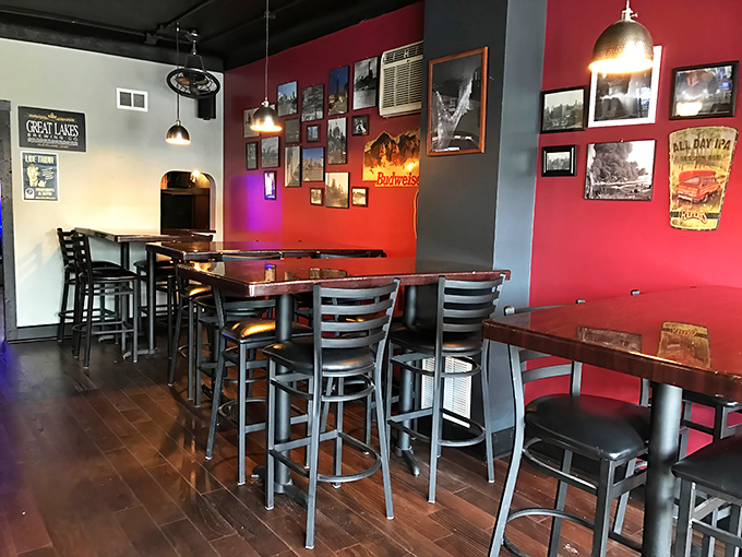 Red walls adorned with local memorabilia create the perfect backdrop for conversations that flow as smoothly as the draft beer.