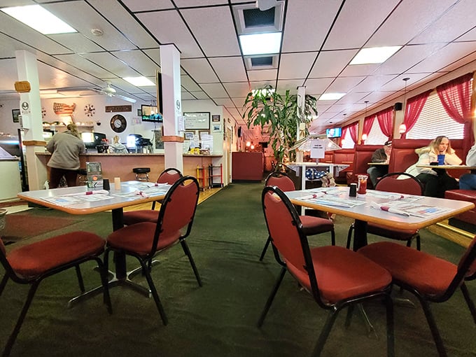 Red chairs and warm lighting create that "grandma's dining room" vibe where calories don't count and conversations flow as freely as the coffee. 