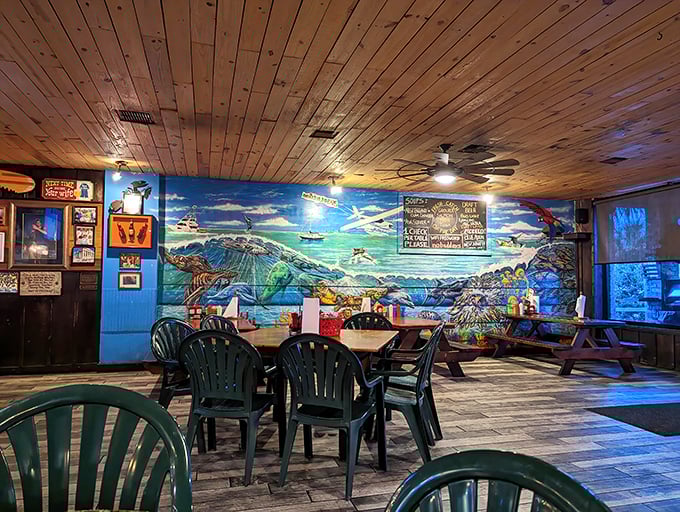 Wooden ceilings, vibrant murals, and plastic chairs – the universal code for "you're about to eat something amazing" at coastal joints worldwide.