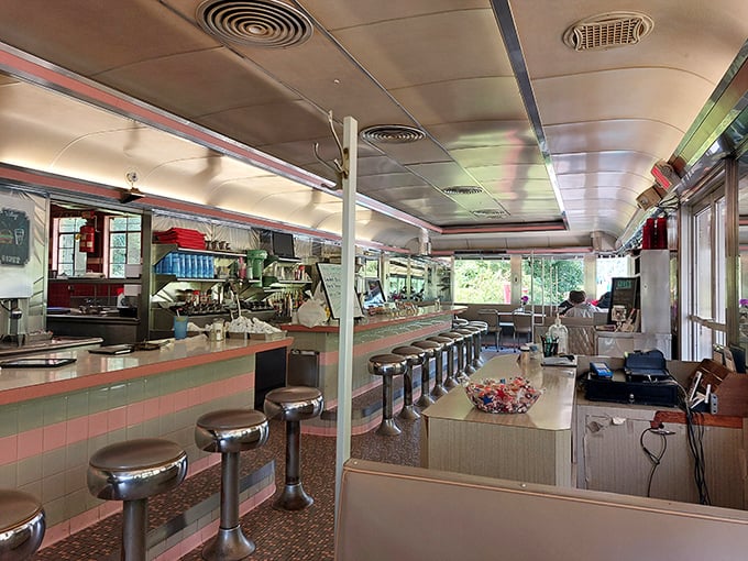 Chrome stools lined up like soldiers ready for delicious duty – the classic diner counter where strangers become neighbors over coffee.