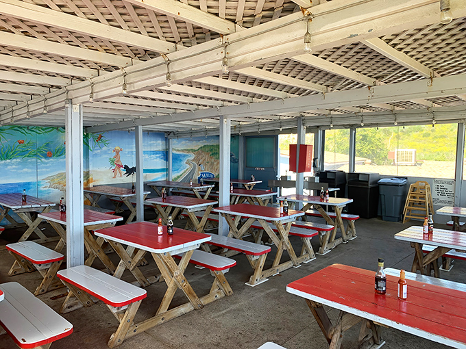 Red-topped picnic tables under a latticed roof create the perfect no-nonsense dining atmosphere. Like a beach cookout, minus having to shake sand out of your shoes.