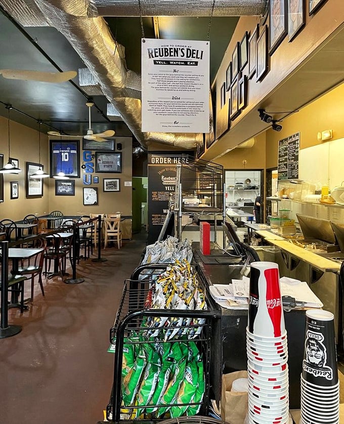 Inside Reuben's, the "YELL. WATCH. EAT." philosophy isn't just signage—it's the authentic deli experience that transports you straight to Manhattan.