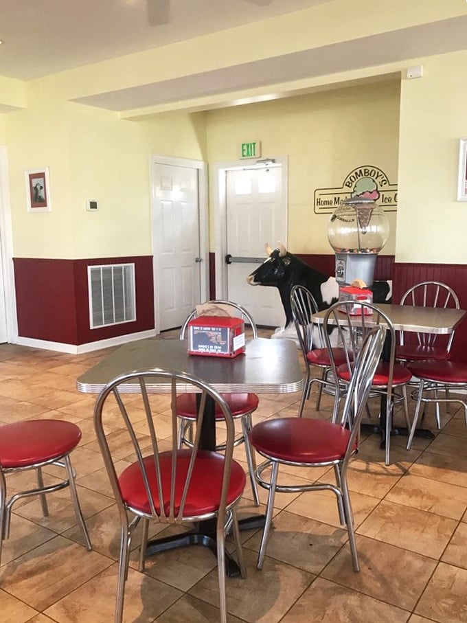 The retro diner seating area features a life-sized cow statue that silently judges your ice cream choices. "Go ahead," she seems to say, "have another scoop."
