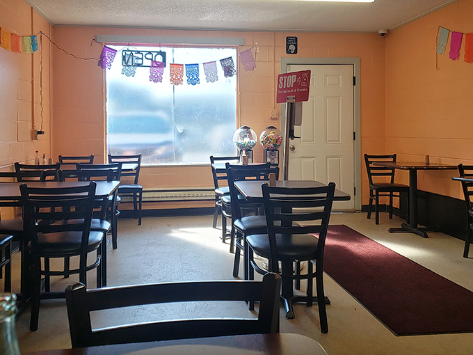 Inside, simplicity reigns supreme. No distractions from the food here—just comfortable seating, salmon-colored walls, and the promise of authentic flavors.