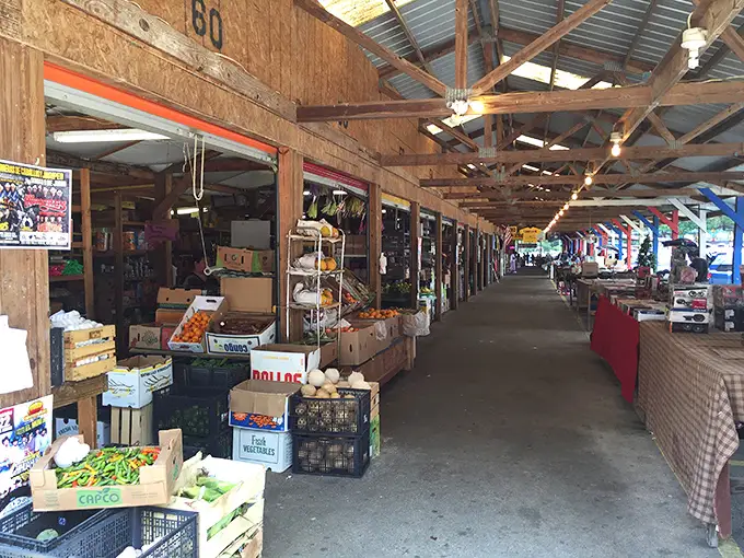 Down these wooden corridors, dreams and deals await. Fresh produce mingles with vintage finds in this covered marketplace where time seems to slow.