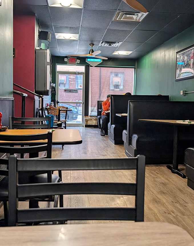 Classic diner ambiance with cozy booths and wood-toned floors creates that perfect "home away from home" feeling every great diner needs.