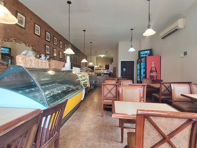 Step inside and the world slows down. Exposed brick walls, pendant lighting, and display cases filled with Italian treasures create the perfect backdrop for carb-induced euphoria. 