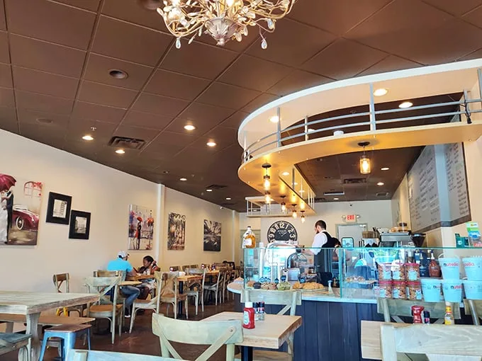 Bright, airy interiors with modern touches create the perfect backdrop for breakfast drama to unfold. The chandelier adds a touch of "fancy pants" to your pancake experience.