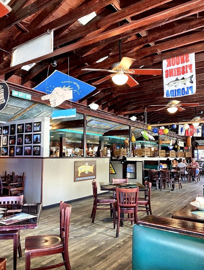 Wooden beams, fishing memorabilia, and that unmistakable coastal vibe—this isn't just a restaurant, it's a tropical state of mind.