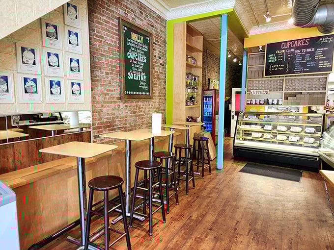 Exposed brick walls, wooden tables, and colorful accents create a space that feels like your coolest friend's apartment—if that friend happened to be a master baker.