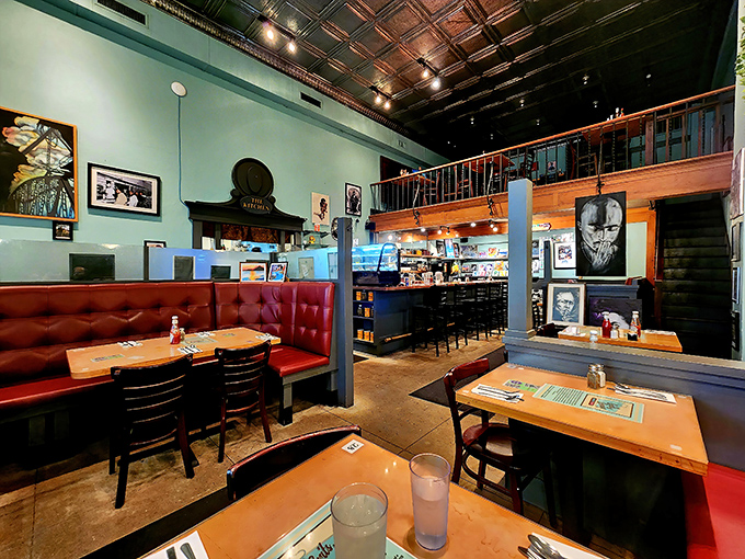 Step inside and the magic reveals itself—soaring tin ceilings, red vinyl booths, and a mezzanine that makes this diner feel like a cathedral of comfort food.