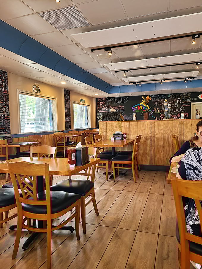 Wooden tables, blue accents, and a chalkboard menu create that perfect "come as you are" vibe. This isn't a place that needs white tablecloths to impress you—the food handles that part.