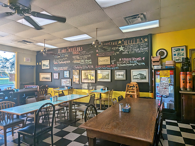 Yellow walls and a chalkboard menu create the perfect backdrop for breakfast magic. This isn't designer decor—it's authentic diner DNA.