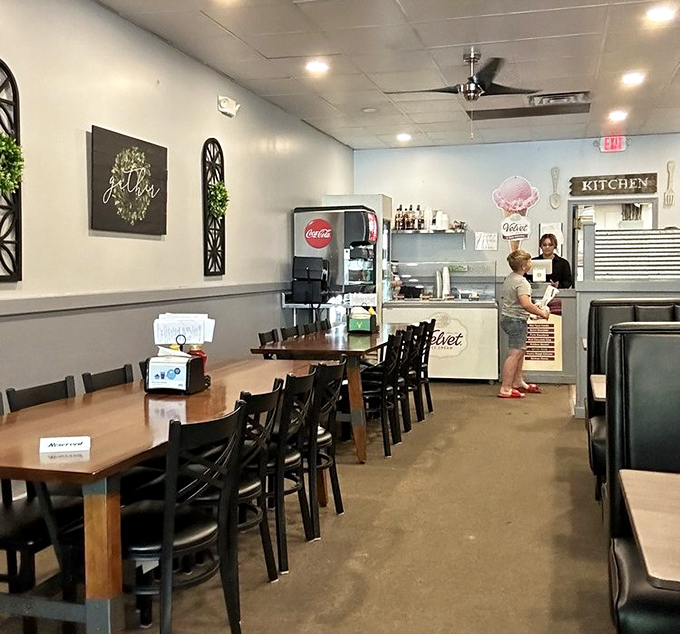 Simple, clean, and welcoming—the interior speaks volumes about Reindeer Grill's philosophy: focus on the food, not the frills. The "gather" sign says it all.