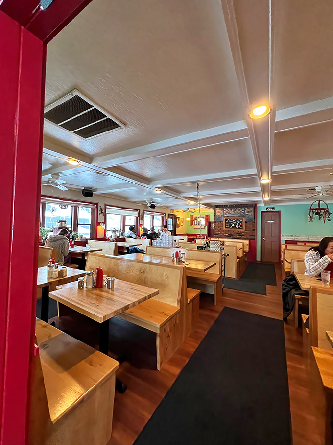 Wooden booths, mint green walls, and the promise of comfort food heaven—stepping inside feels like entering your favorite aunt's kitchen, if she were a breakfast genius.