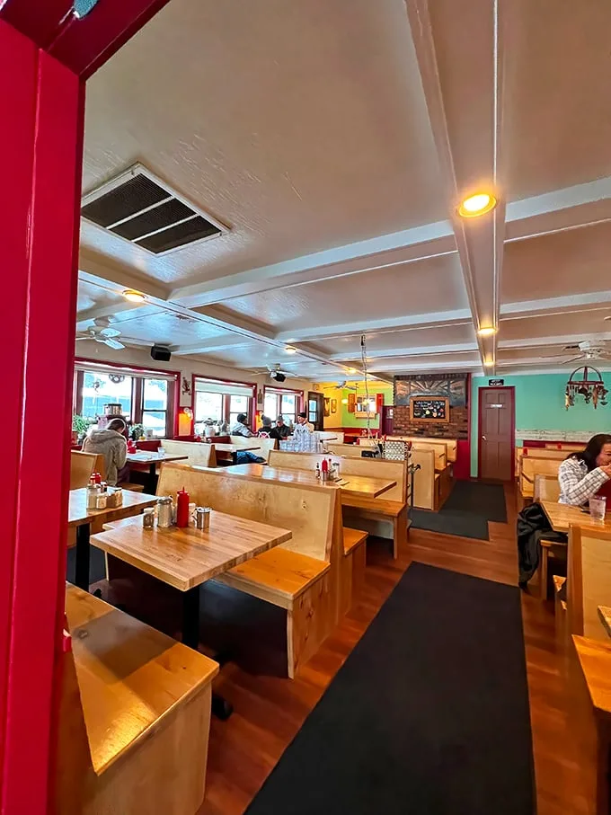 Wooden booths, mint green walls, and the promise of comfort food heaven—stepping inside feels like entering your favorite aunt's kitchen, if she were a breakfast genius.