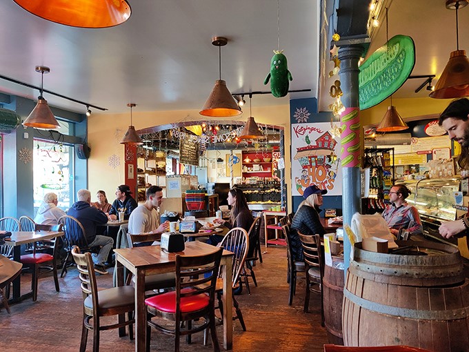 Inside Katzinger's, copper pendant lights cast a warm glow over wooden tables where generations have gathered to debate the merits of mustard versus Russian dressing.
