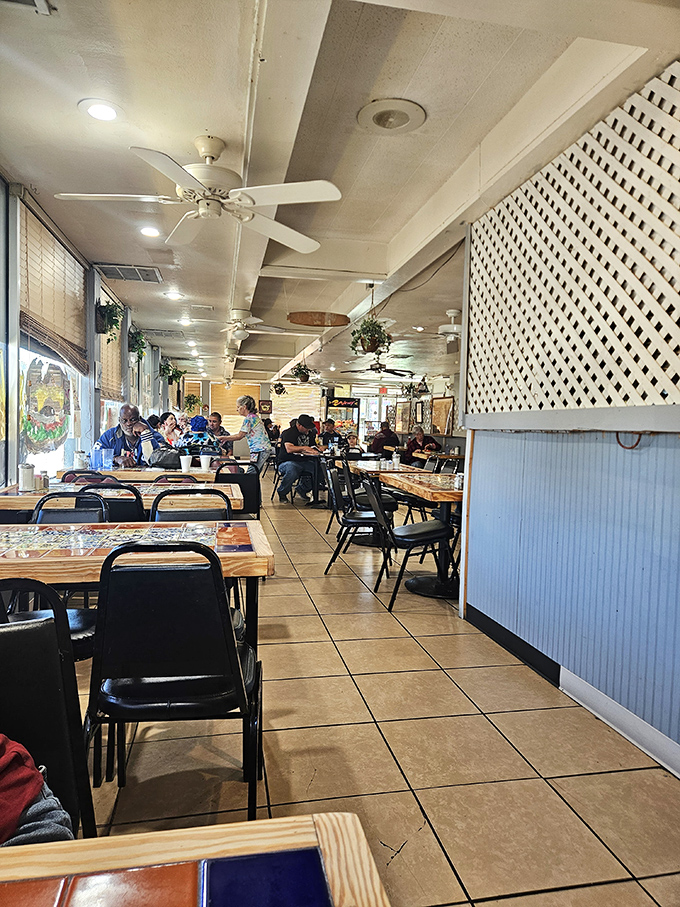 Inside, ceiling fans lazily spin above tables where regulars solve the world's problems over coffee and where nobody's checking their watch.