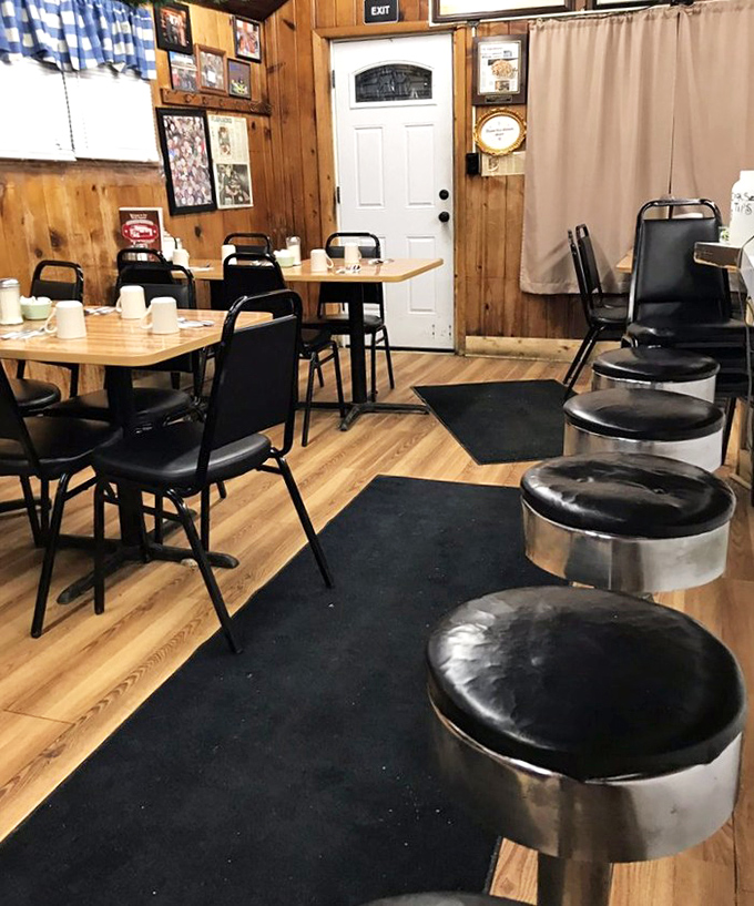 Where wood paneling meets breakfast magic. The cozy interior feels like stepping into your favorite aunt's kitchen—if she could flip pancakes the size of hubcaps.