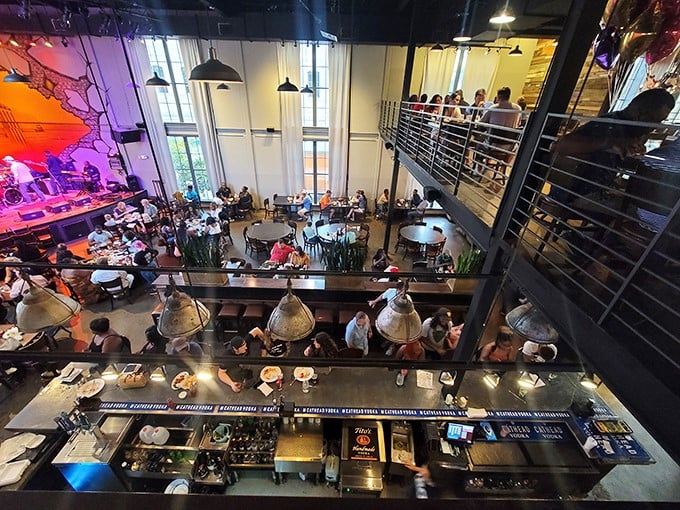 A culinary amphitheater where diners become spectators to the art of gastronomy, complete with mezzanine seating for the full sensory show.