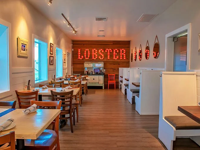 That glowing "LOBSTER" sign isn't just decor—it's a beacon calling seafood lovers home to a space where coastal comfort meets culinary excellence.